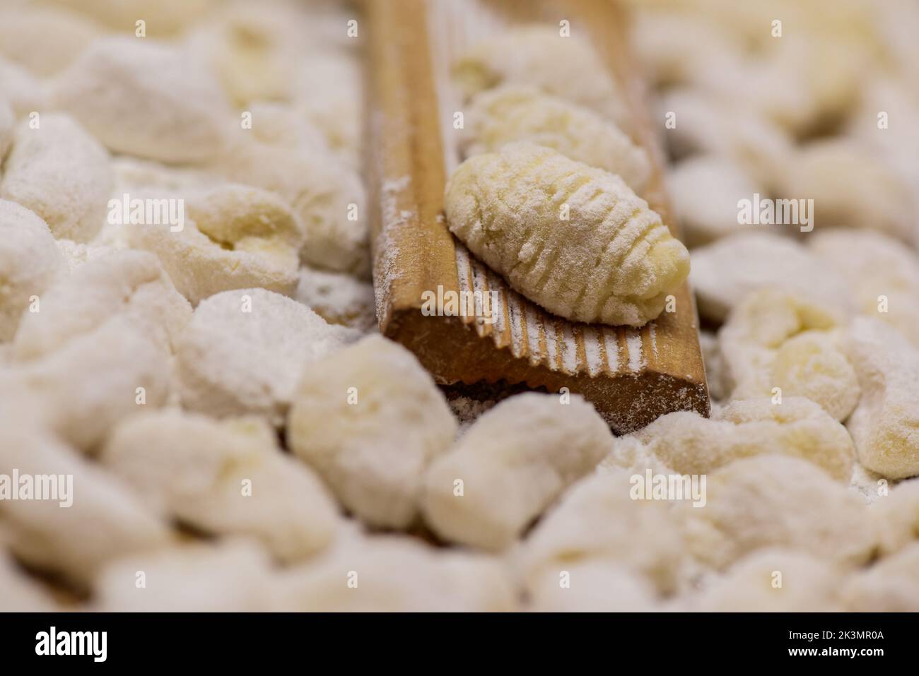 Preparation of gnocchi, on the table. Traditional Italian food Stock ...