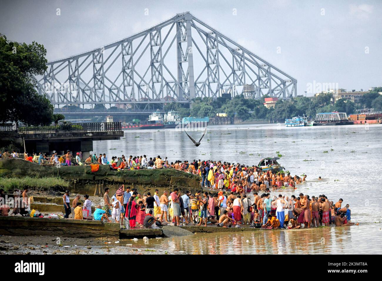 Crowds of devotees are seen in the River Ganges during the celebration ...