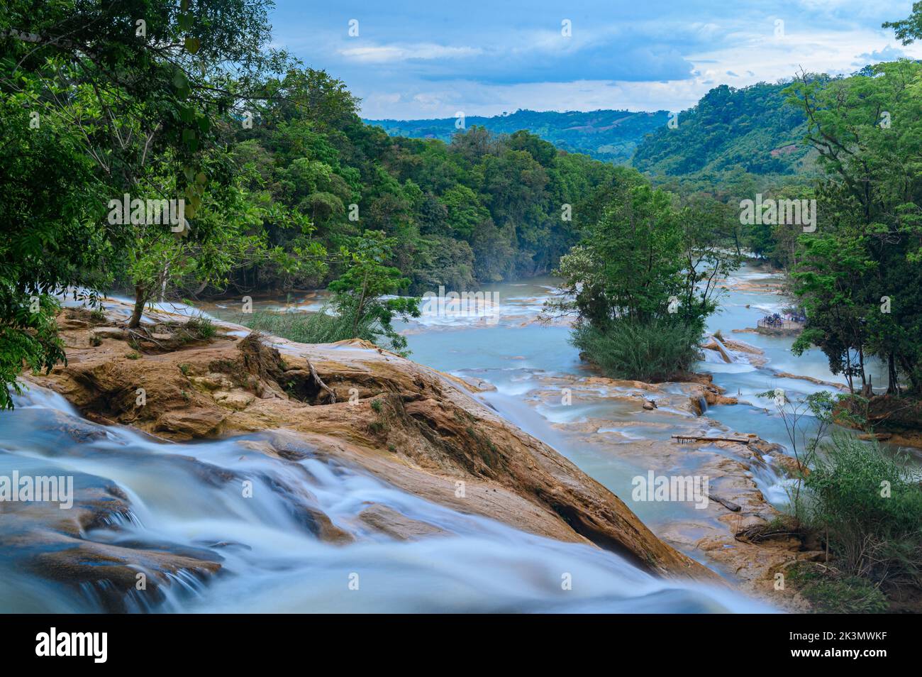 A beautiful shot of the Agua Azul Waterfalls surrounded by greenery in ...