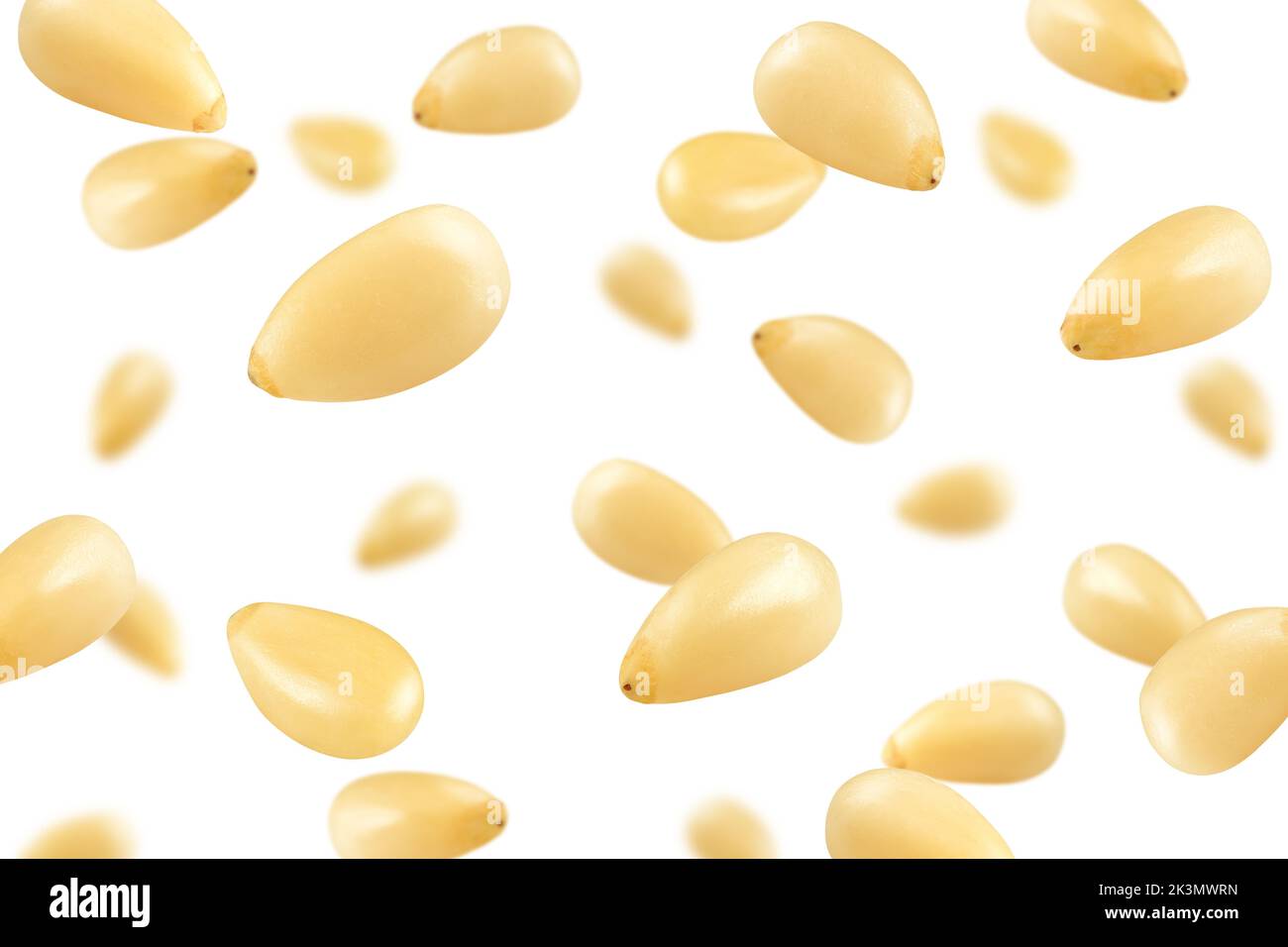 Falling Pine nuts isolated on white background, selective focus Stock ...