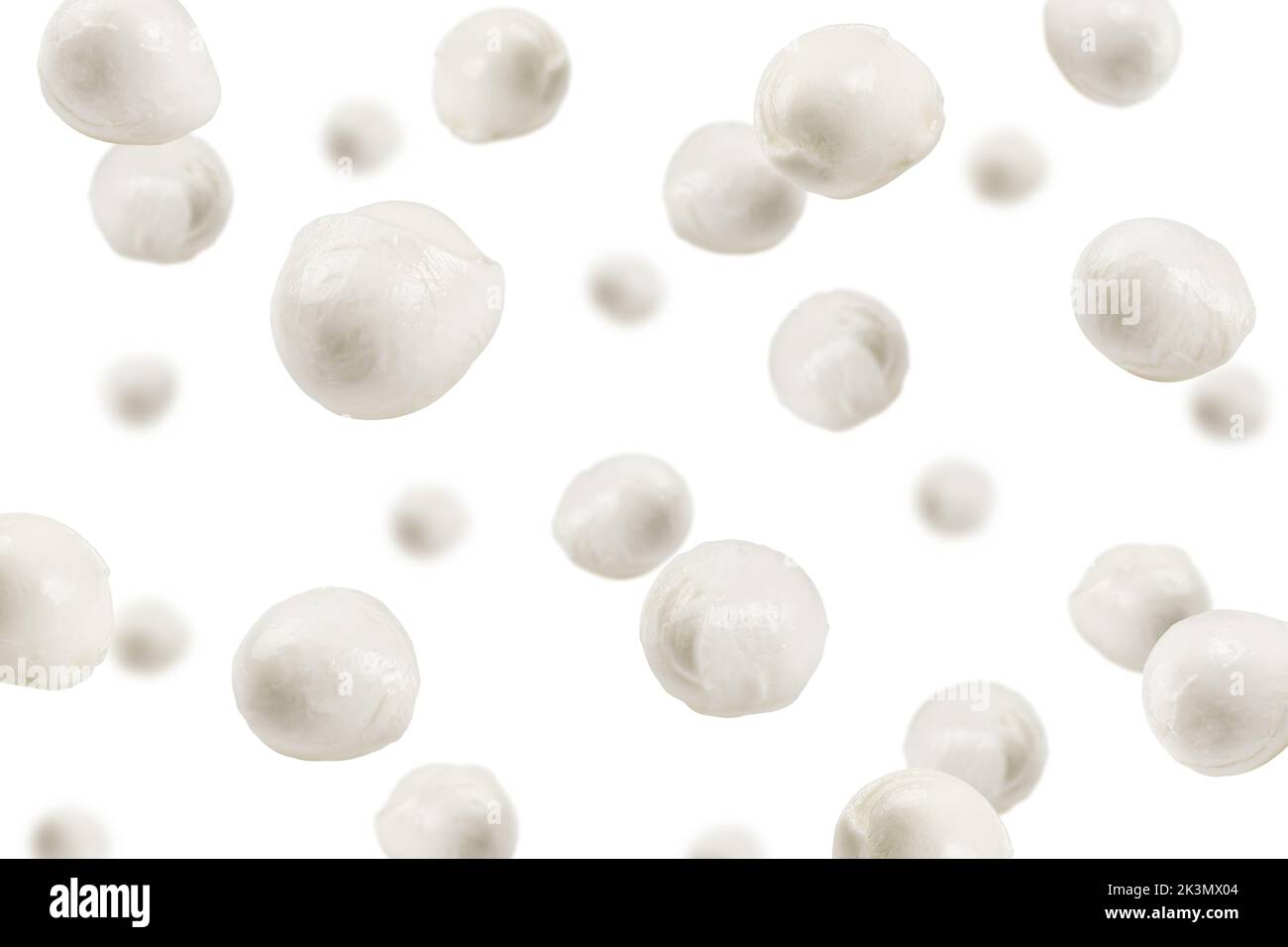 Falling Mozzarella cheese isolated on white background, selective focus ...