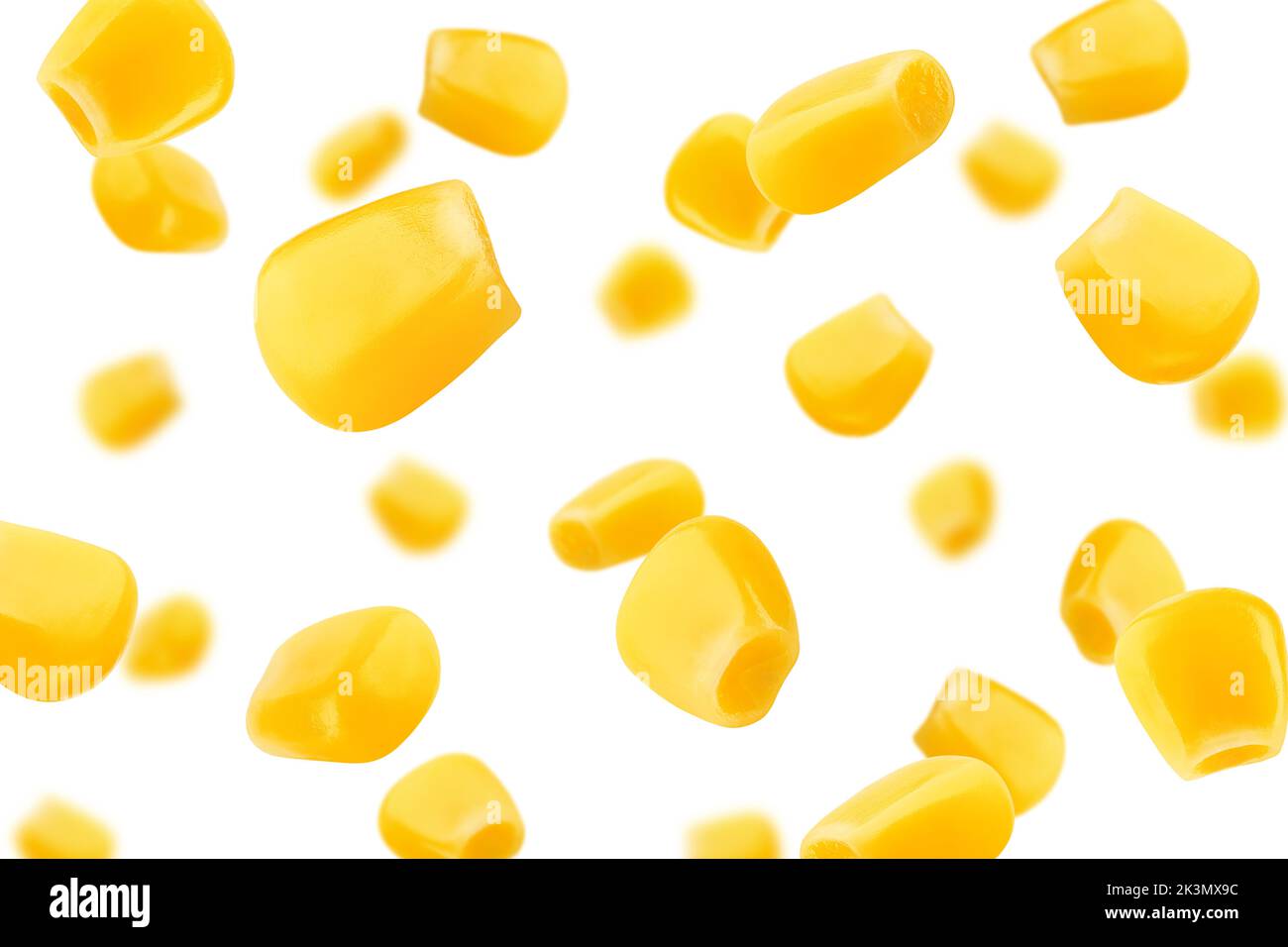Falling corn seeds isolated on white background, selective focus Stock ...