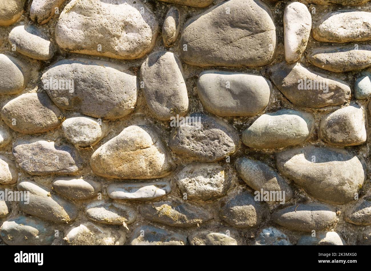 The texture of the wall of brown stone masonry. Backgrounds and ...