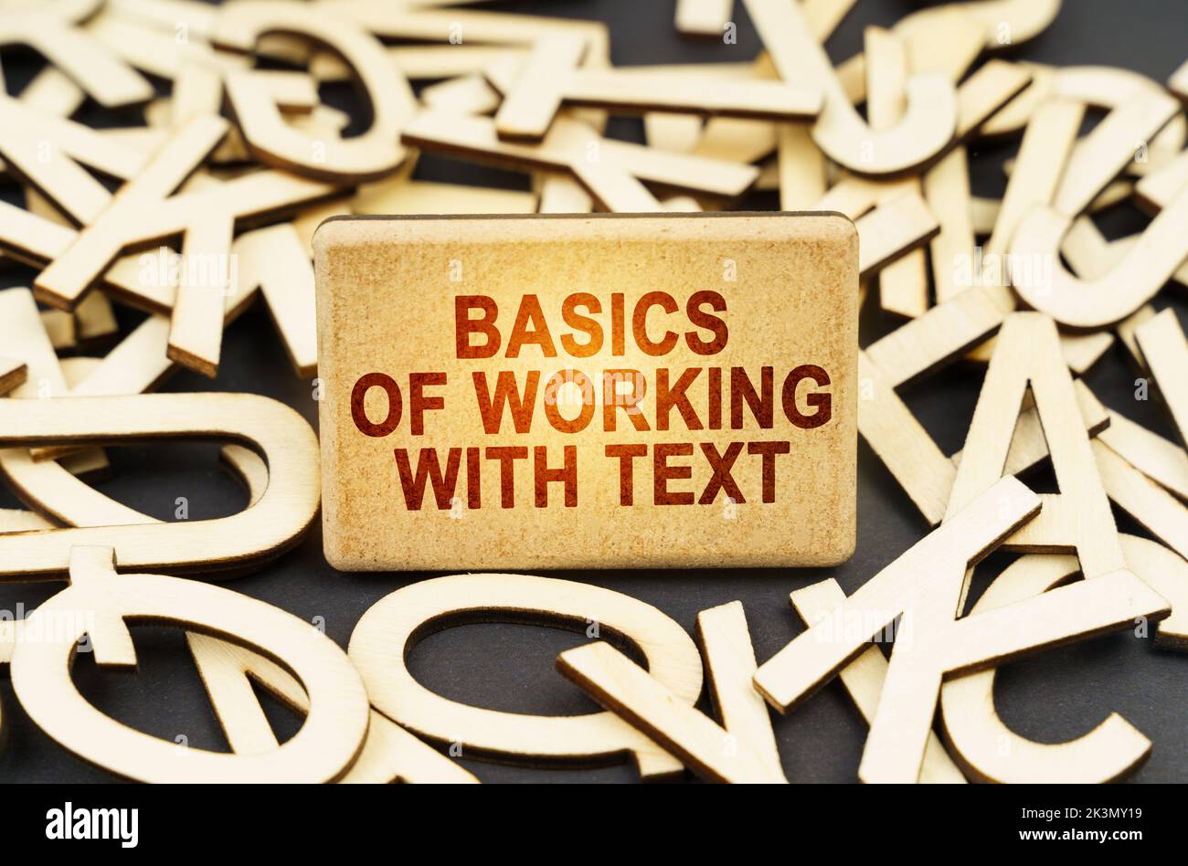 Education concept. Among the wooden letters is a sign with the ...