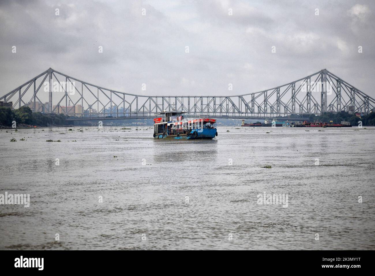 A passenger vessel (boat) seen on the River Ganges crossing the famous ...
