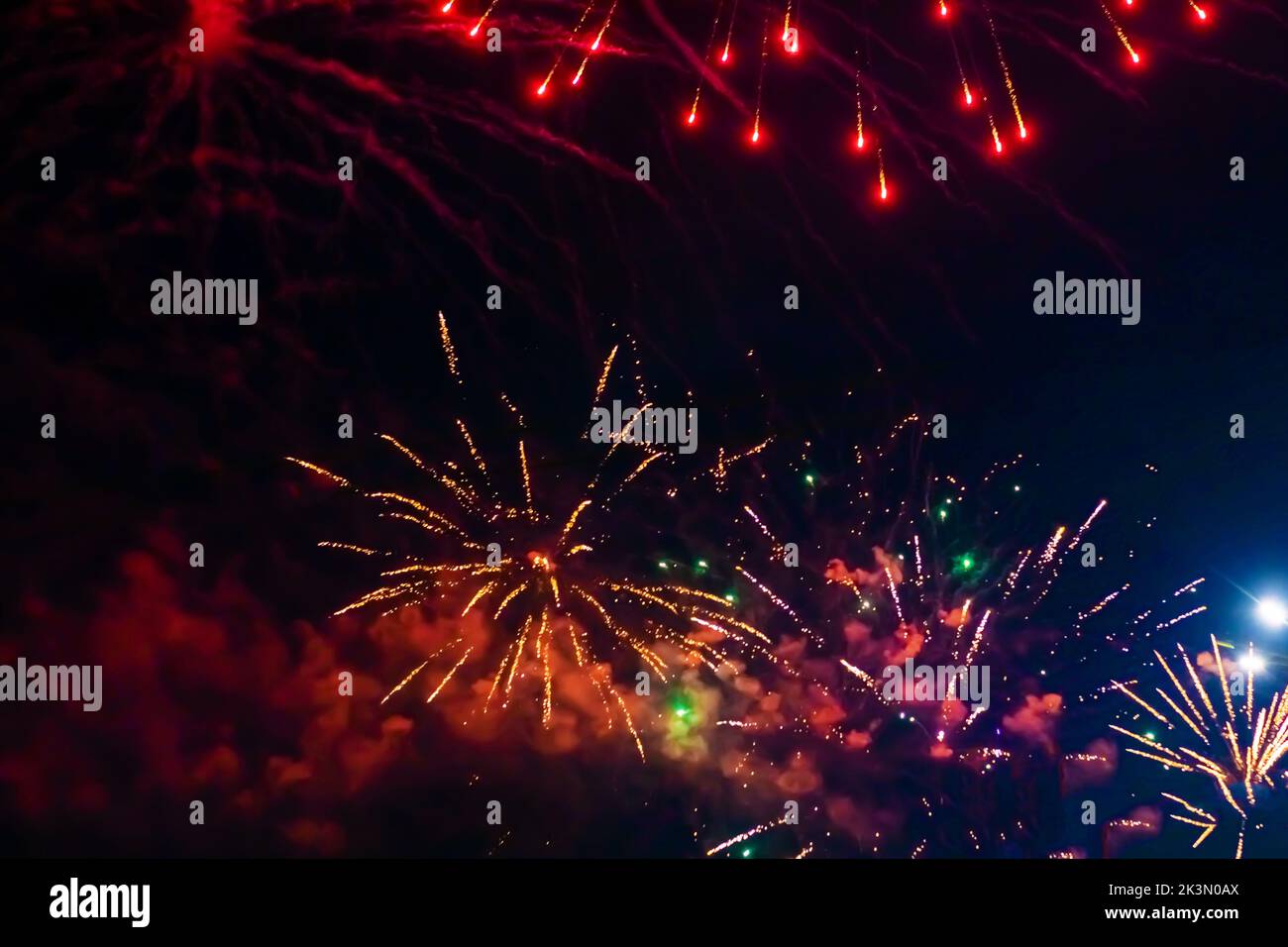 Beautiful multi-colored fireworks against the background of the night ...
