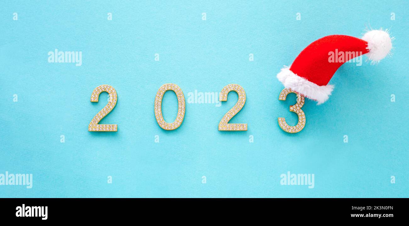 Happy New Year 2023. Golden numbers with rhinestone text 2023 and Santa ...