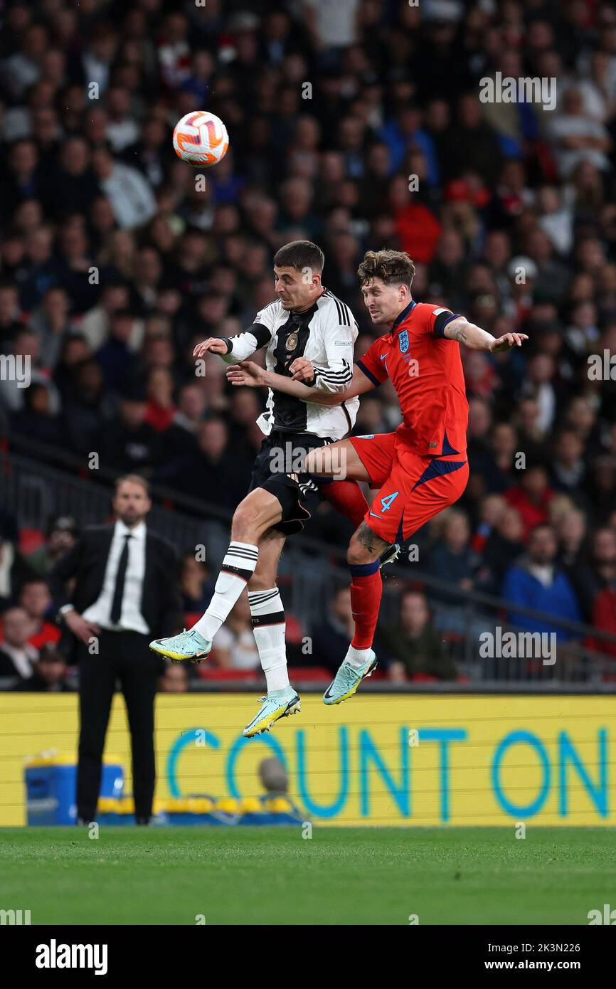 London, UK. 26th Sep, 2022. John Stones of England (r) jumps for a ...