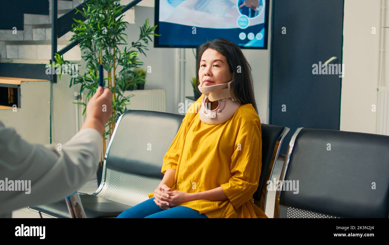 Senior doctor doing concussion examination for patient with cervical ...
