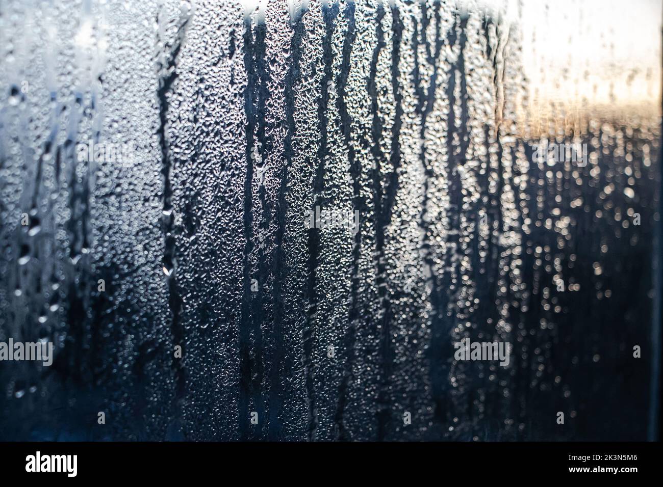 Texture of misted glass in winter. Frozen drops of water in sun on ...