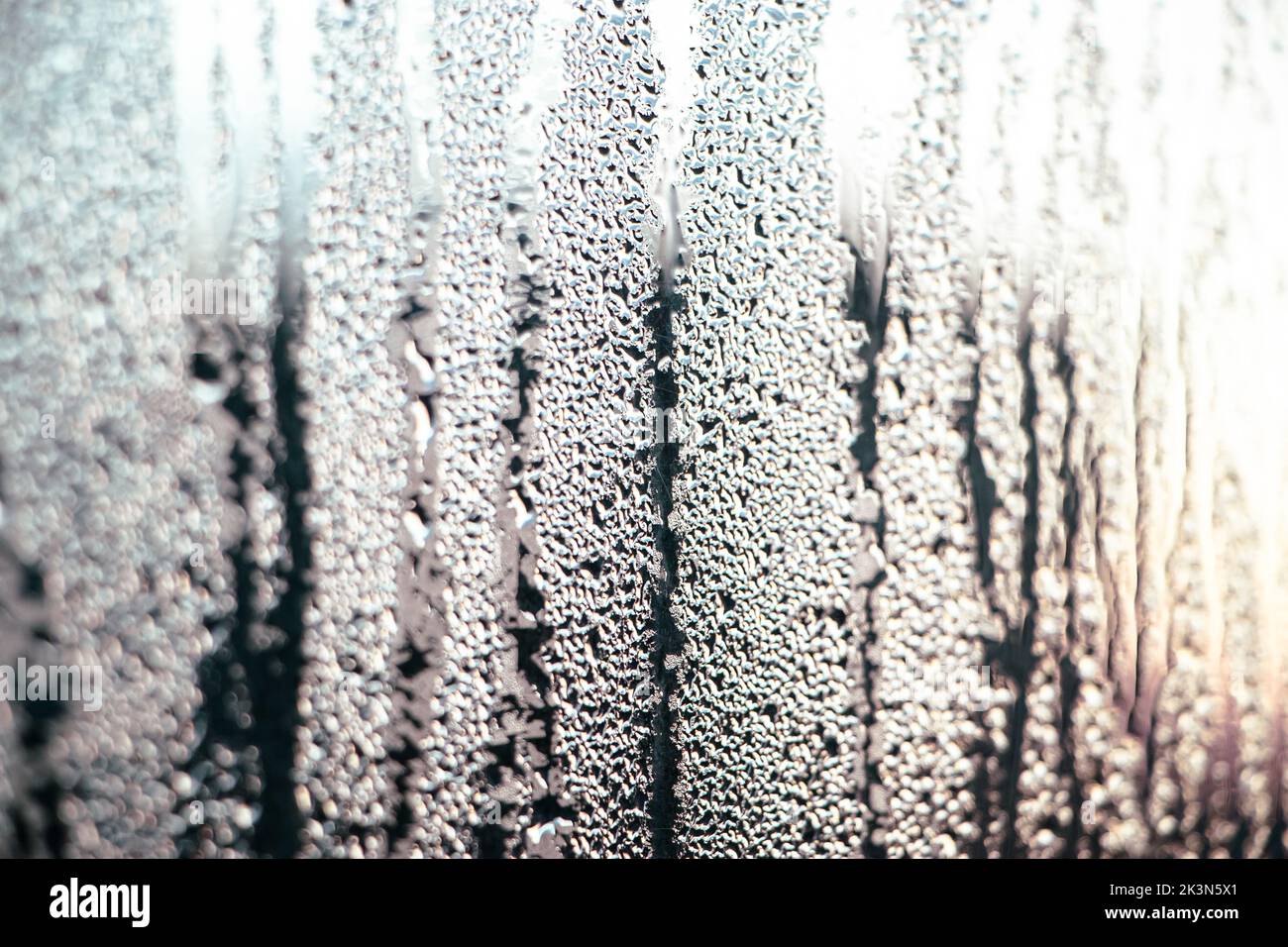 Texture of misted glass in winter. Frozen drops of water in sun on ...