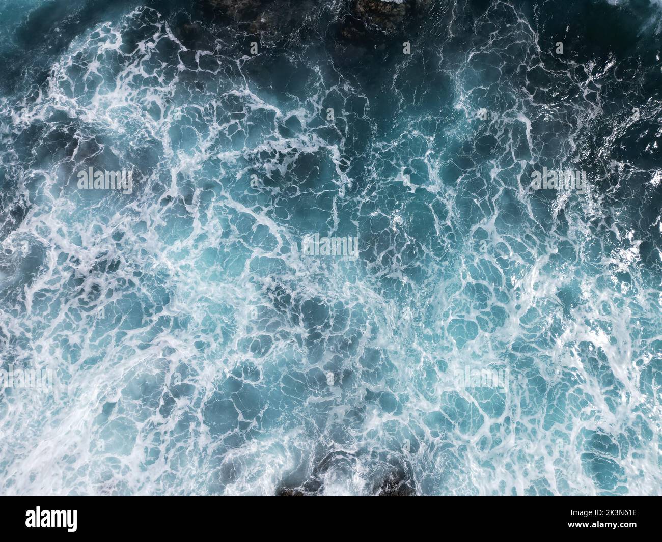 A high angle shot of flowing waves and ripples on a sea surface Stock ...