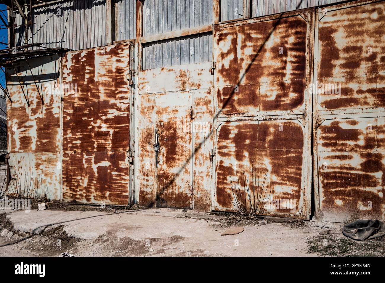 Old destroyed construction site. Rusty scaffolding and construction ...