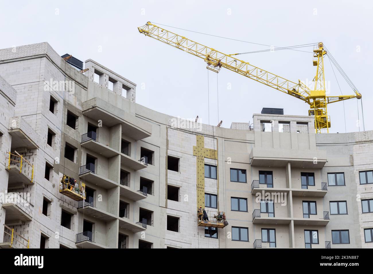 The process of insulating external walls in a multi-storey building ...