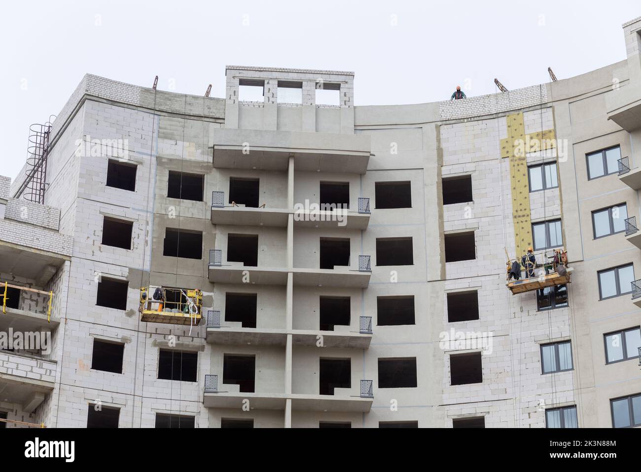 The process of insulating external walls in a multi-storey building ...
