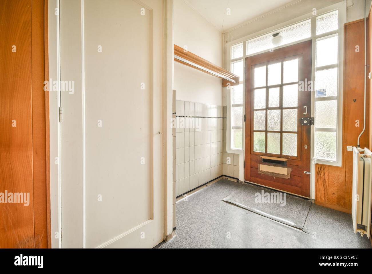 Corridor of contemporary apartment with black closets and opened ...