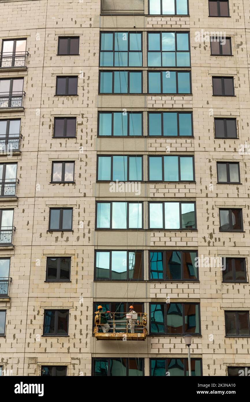 The process of insulating external walls in a multi-storey building ...