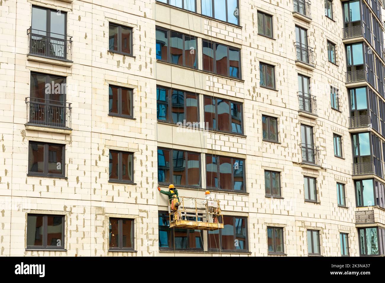 The process of insulating external walls in a multi-storey building ...