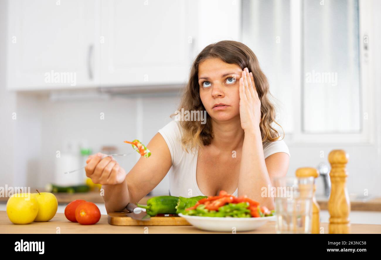 Sad woman eating hi-res stock photography and images - Alamy