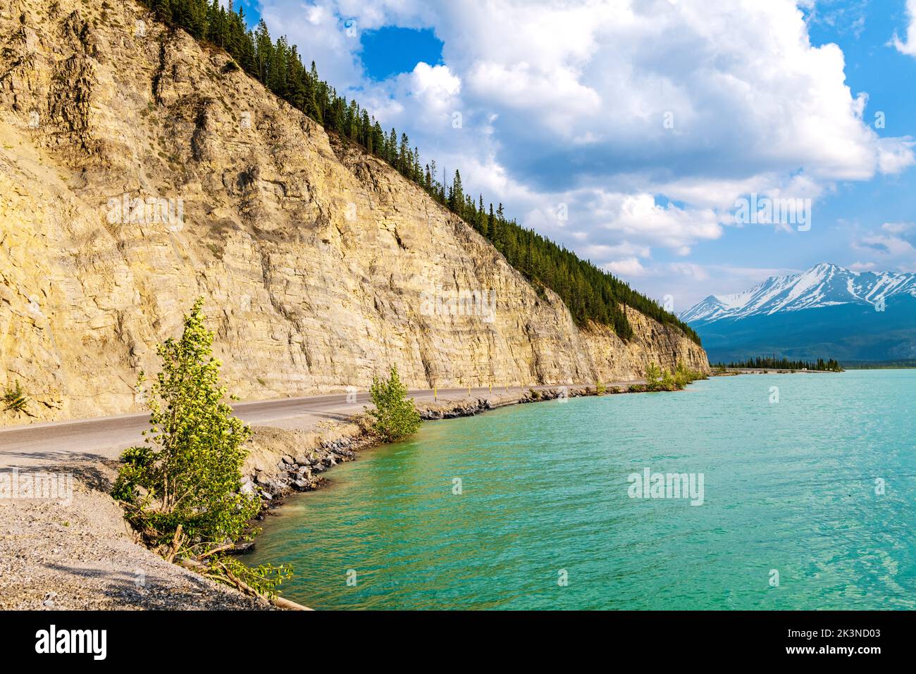 Alaska Highway along Muncho Lake, surrounded by Canadian Rocky ...