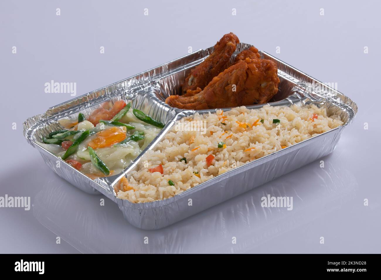 Schezwan Chicken Fried Rice in white bowl isolated on white background ...