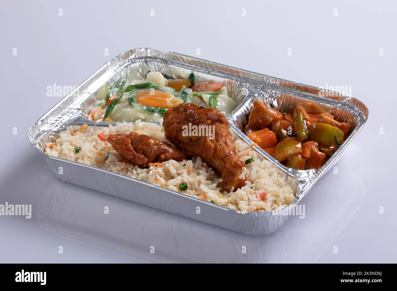 Schezwan Chicken Fried Rice in white bowl isolated on white background ...