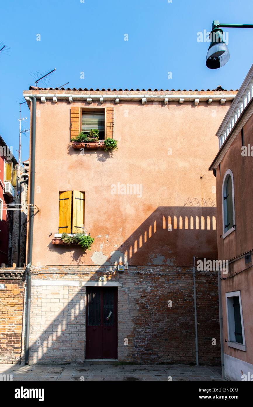 A red house in the Murano Island, Venice Stock Photo - Alamy