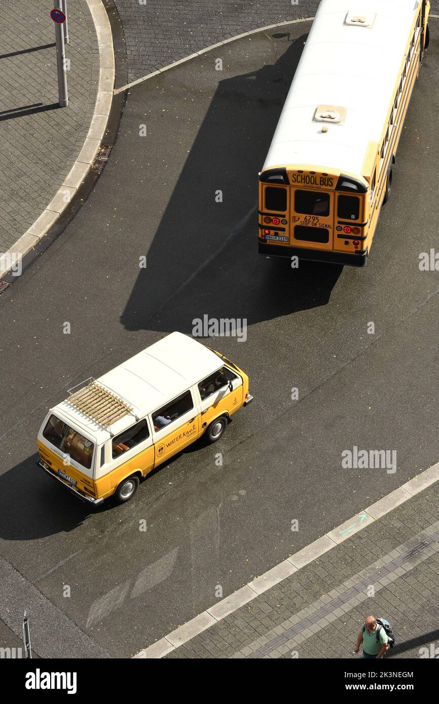 An aerial view of an American school bus with a white and yellow small ...