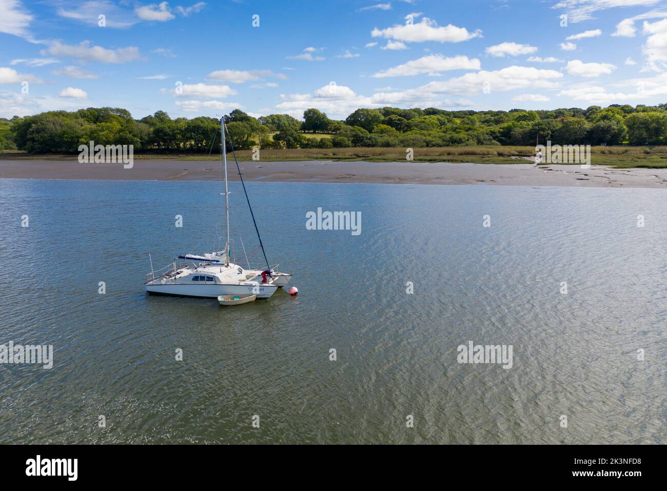 An aerial view of a catamaran sailing boat in the river Cleddau ...