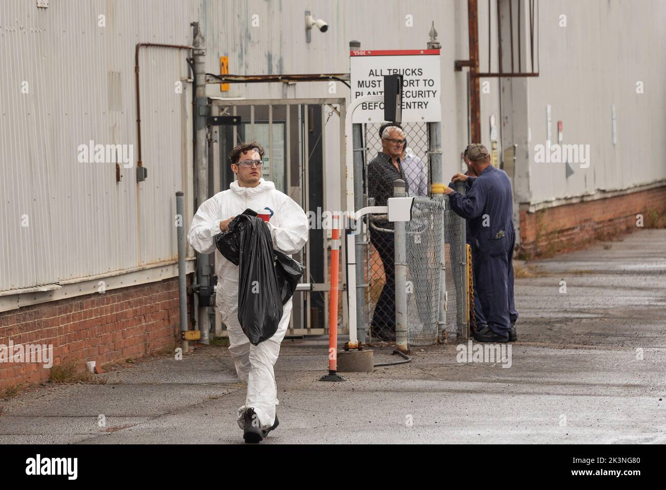 Employees of THK Rhythm Automotive plant wait outside of the St ...
