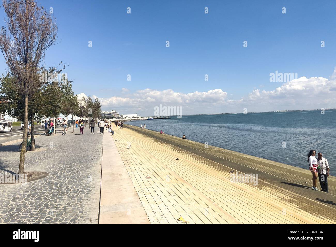 Group of friends hanging out on the pier Stock Photo - Alamy