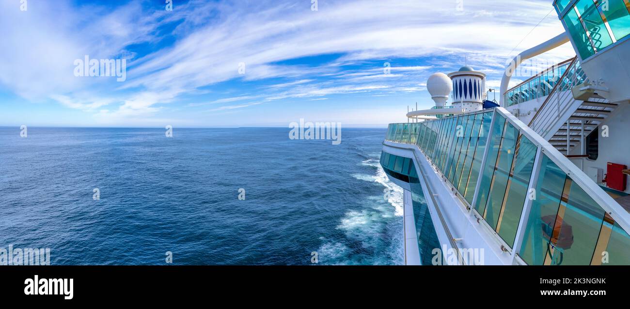 Panoramic ocean view of luxury cruise ship deck heading to a family ...