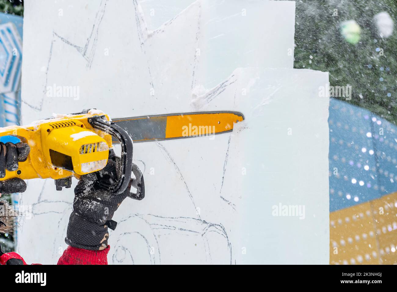 Making Christmas decorations. Master sculptor carves ice sculpture with ...