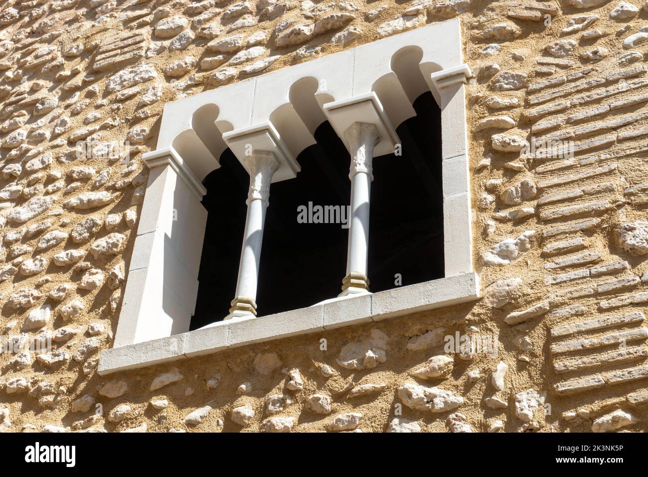 The low-angle view of renewed window frame on the old stone wall Stock ...