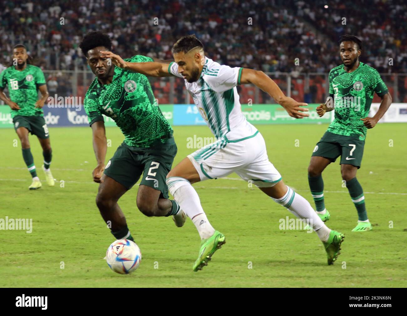 Oran. 28th Sep, 2022. Algeria's Youcef Belaili (R, front) vies with Nigeria's Ola Aina (L, front ...