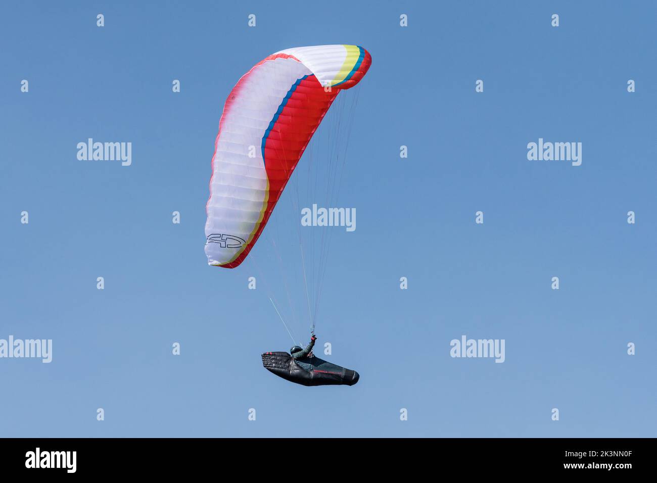 Paraglider pilot flying in an aerodynamic fairing harness Stock Photo ...