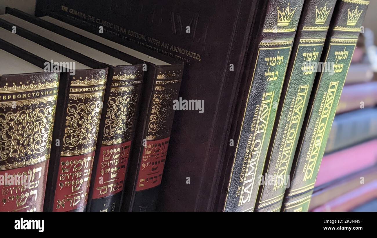 A closeup shot of Hebrew Bible books on the bookshelf Stock Photo - Alamy