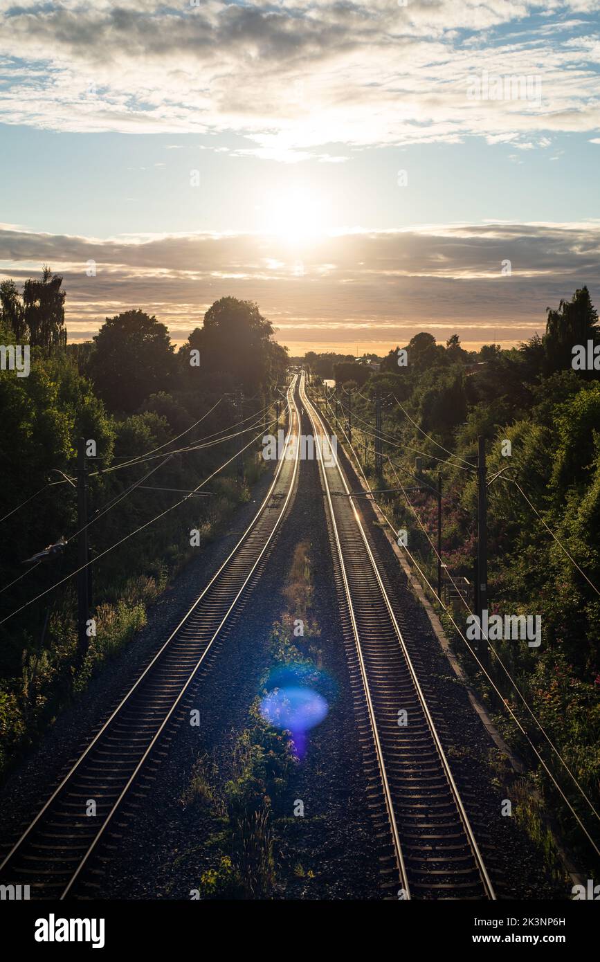 Afternoon Photo of a Railway with artistic lens flare Stock Photo - Alamy
