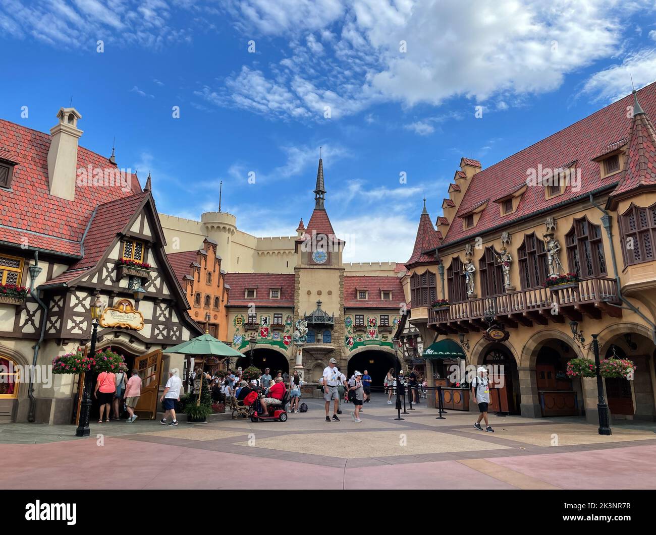 Bay lake, FL USA - September 15, 2022: Roadside view of tourists walking down the Germany ...