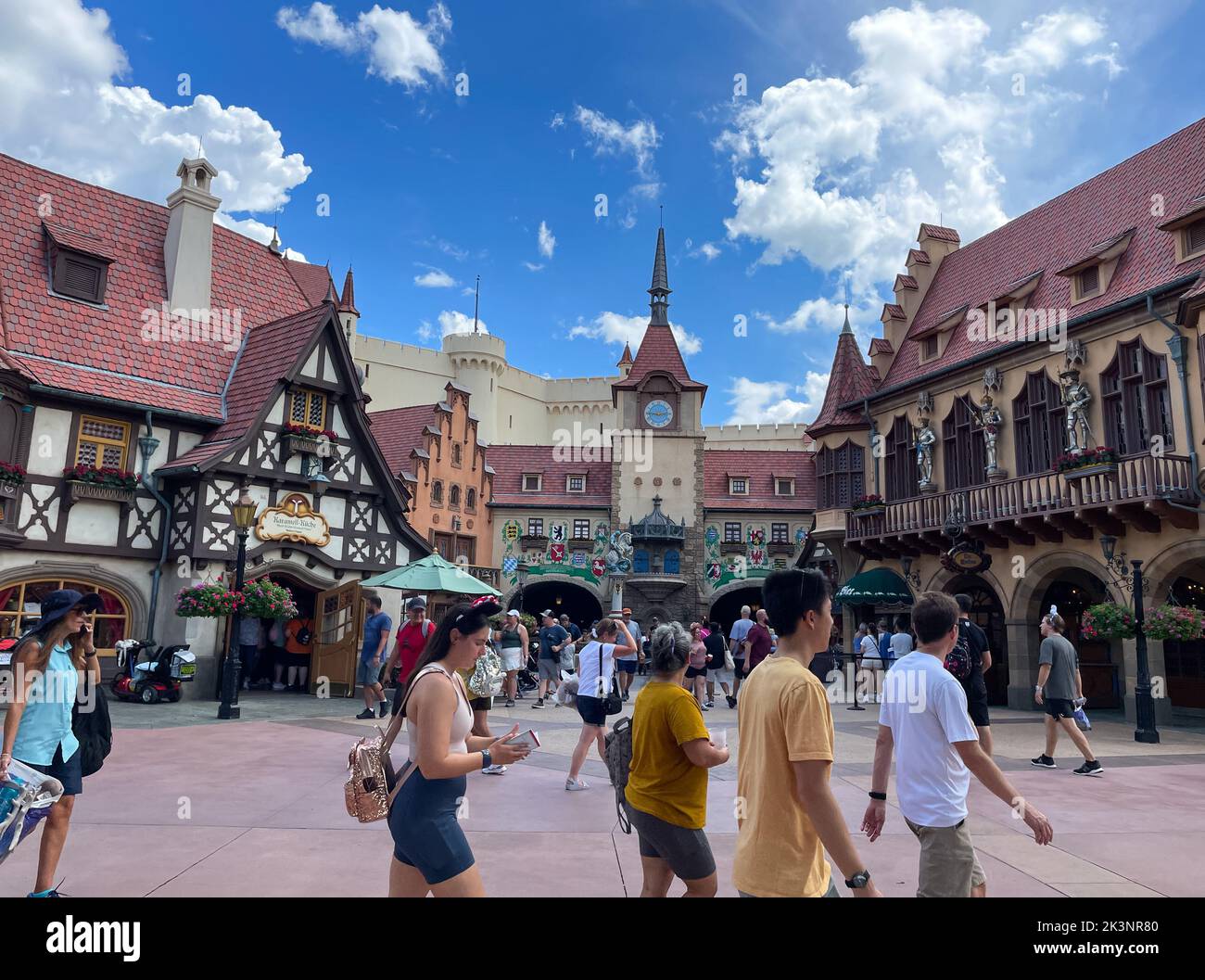 Bay lake, FL USA - September 15, 2022: Roadside view of tourists walking down the Germany ...