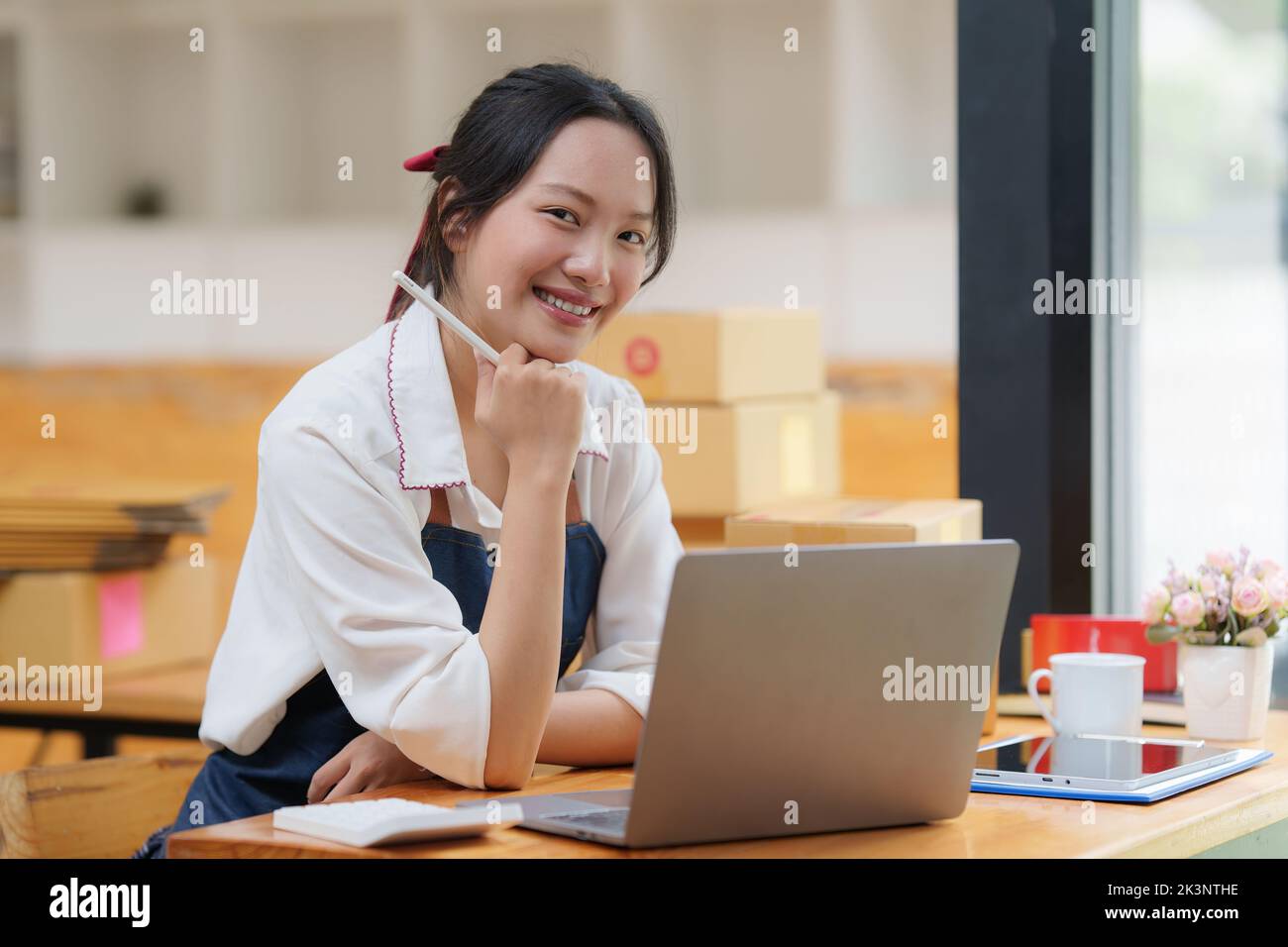 Asian small business owner working at home office. Business retail ...