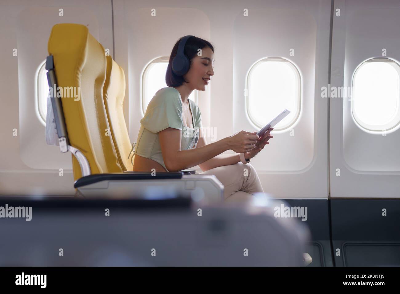 Young asian woman using digital tablet connected to wifi internet ...