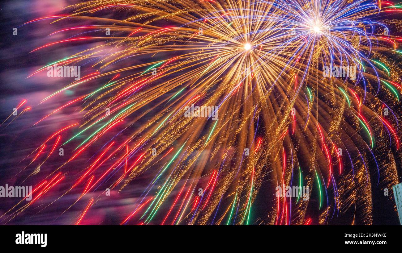 The beautiful colorful firework in the night sky Stock Photo - Alamy