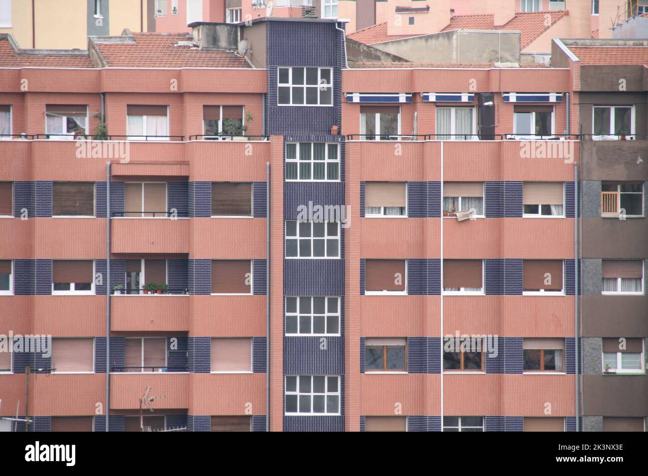 A closeup of a high modern apartment building block in Bilbao Spain ...