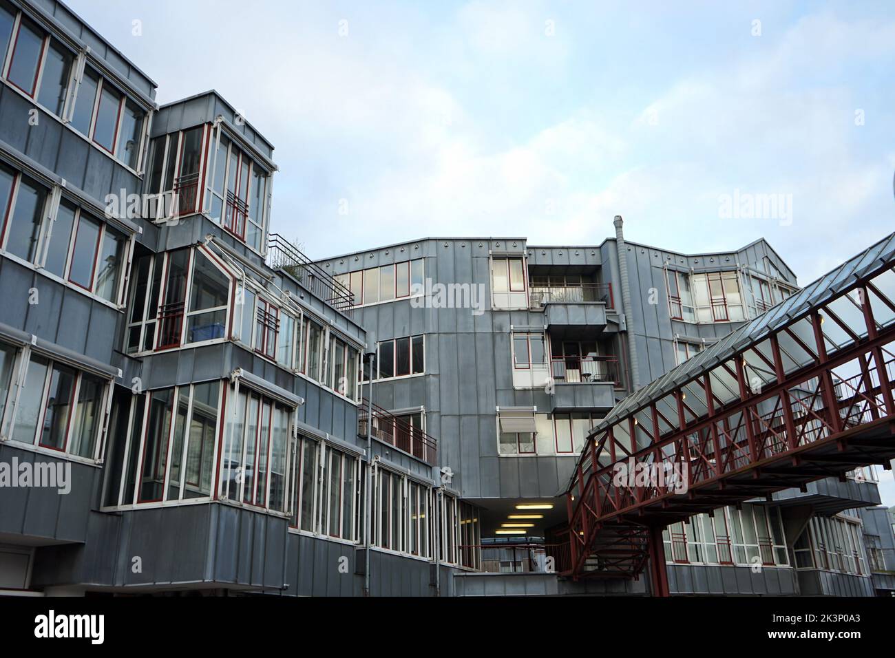 The modern architectural gray building with the overpass side view ...