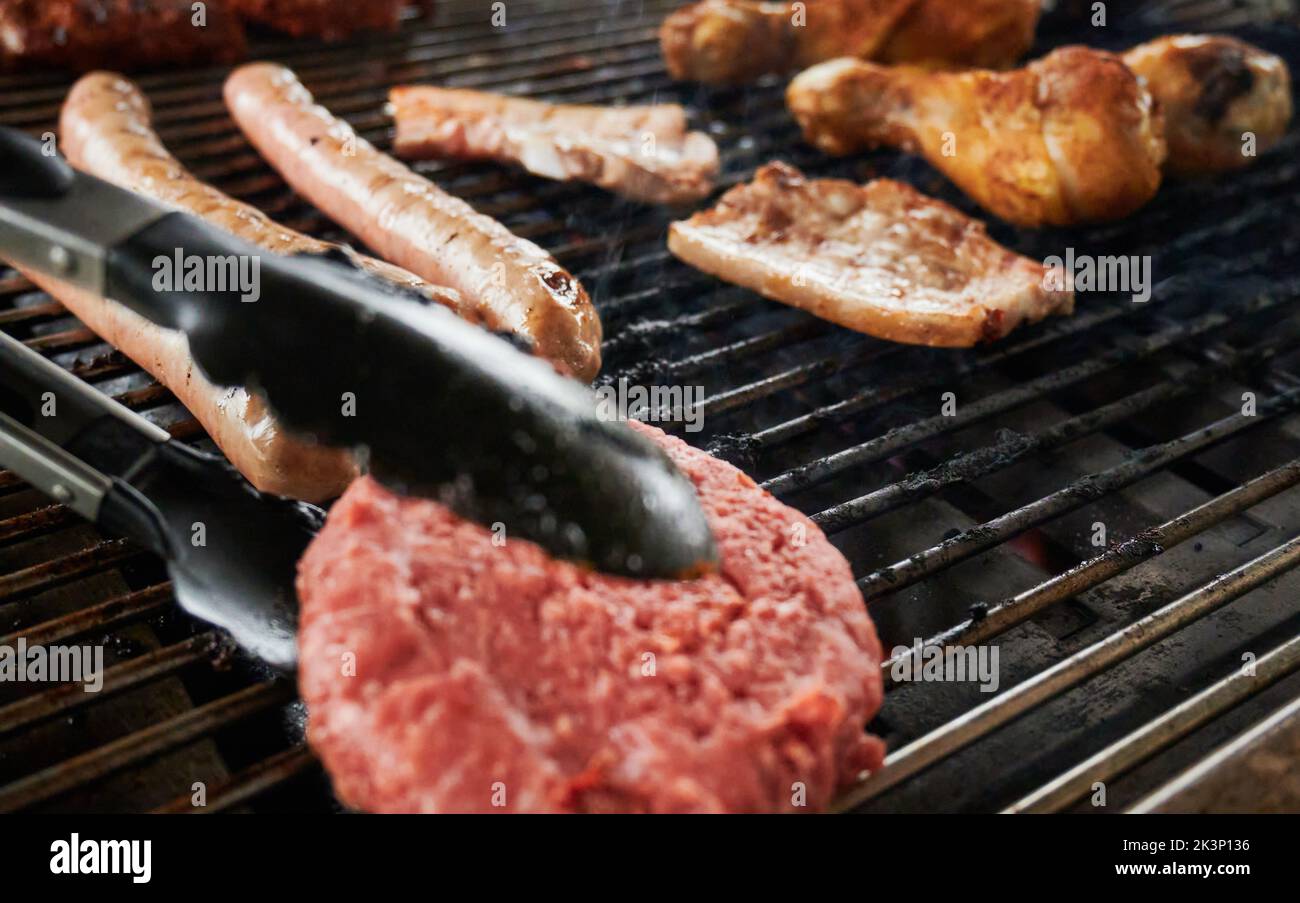 Flipping steak on grill hi-res stock photography and images - Alamy