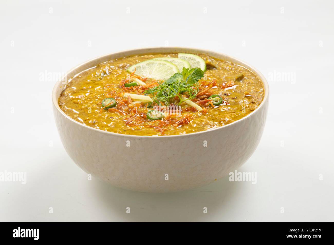 Top View Of Beef Haleem with naan, green background.Haleem with Spices ...