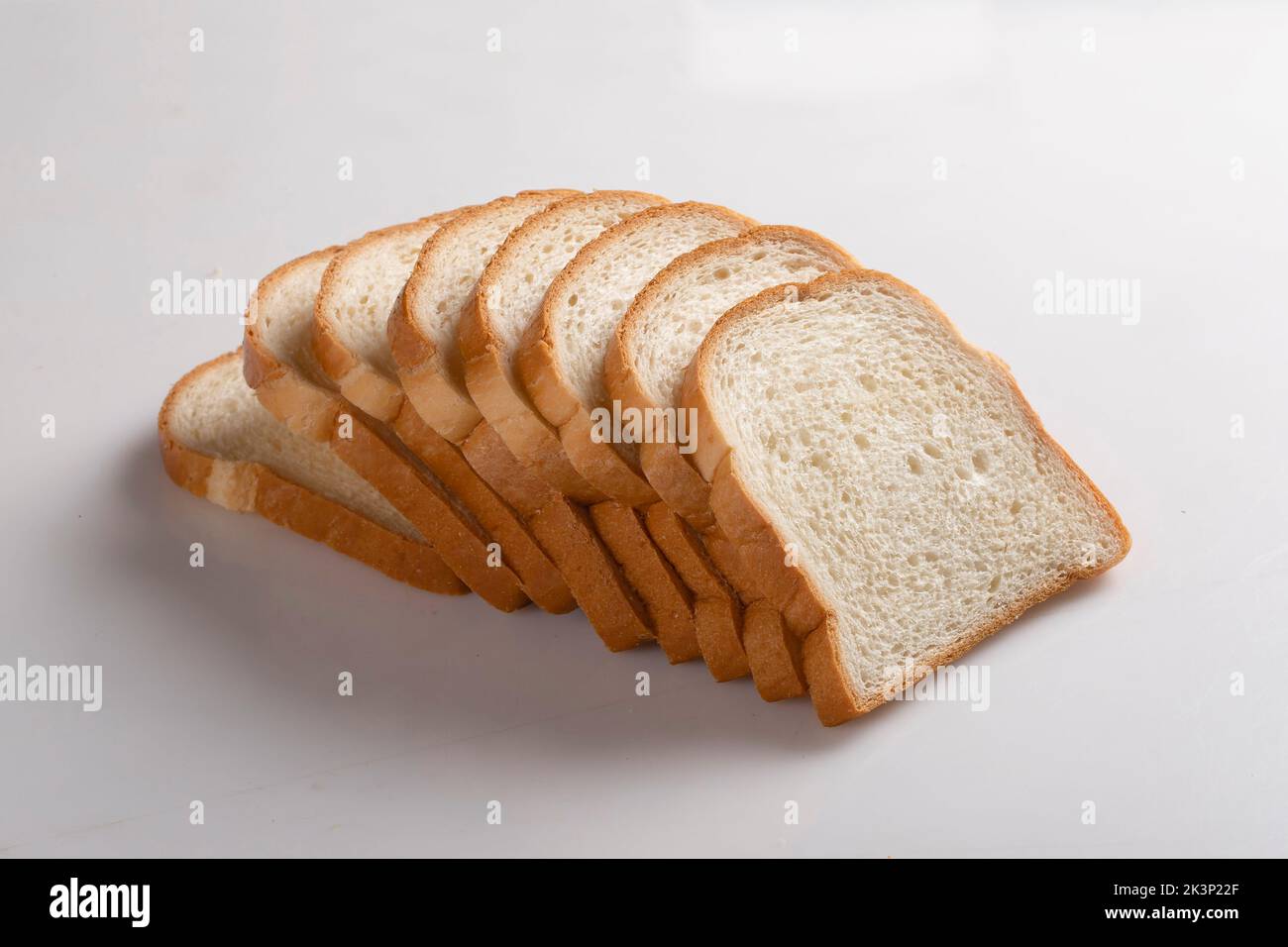 Sliced bread isolated on a white background. Bread slices and crumbs ...