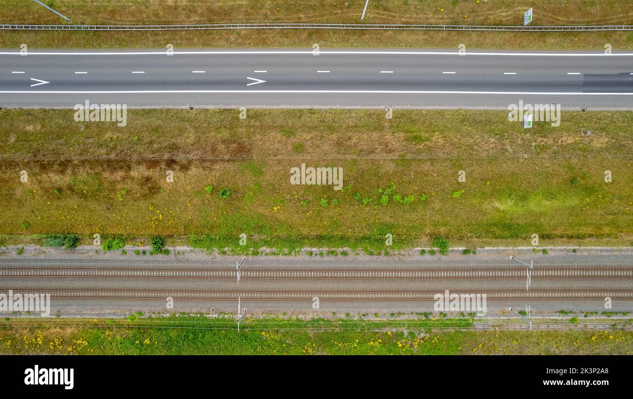 Aerial view of highway road junction. Highways, bridge and green fields ...