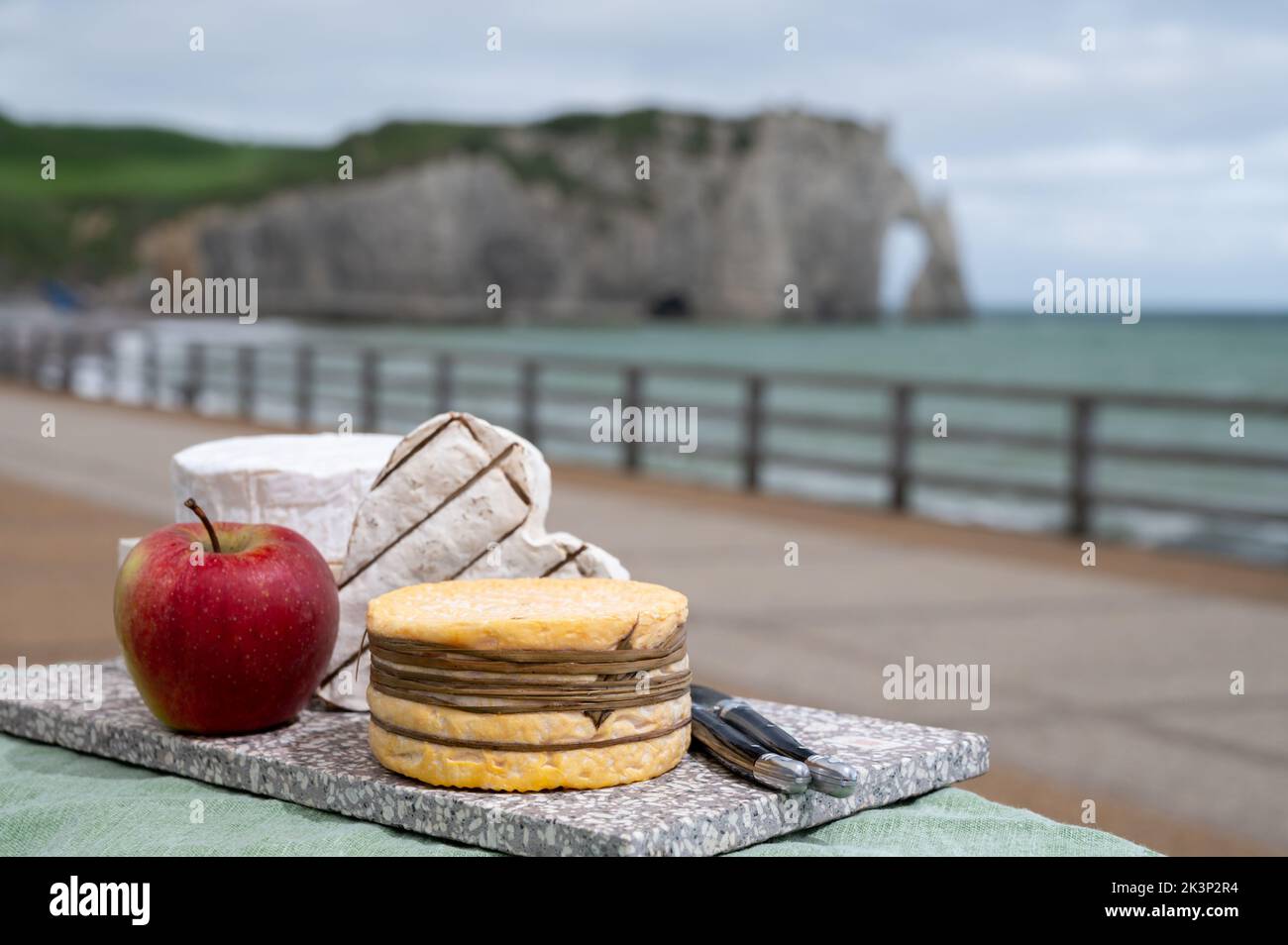 Cheeses of Normandy served outdoor, round camembert cow cheese, yellow ...